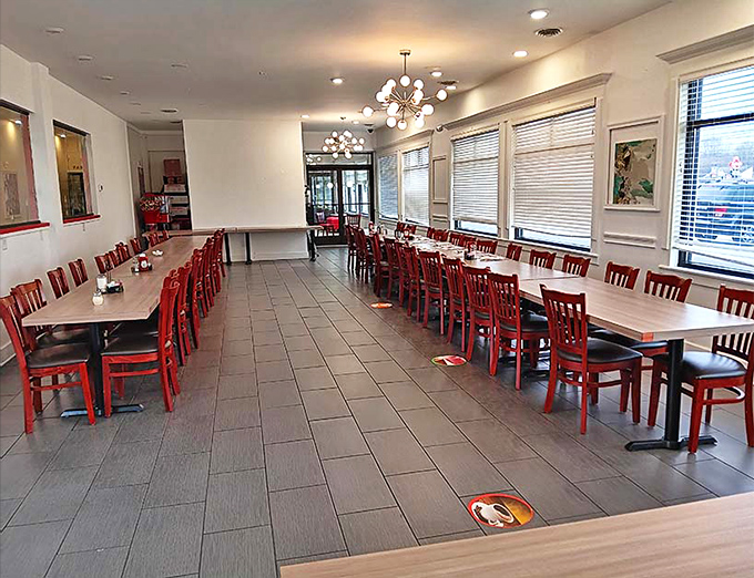 Those red chairs aren't just furniture; they're an invitation to stay awhile and solve the world's problems over coffee.