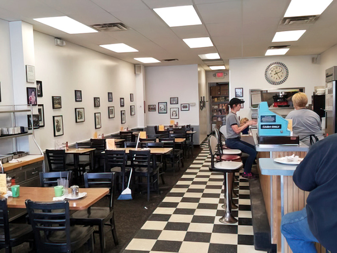 That checkered floor has seen more breakfast revelations than a morning talk show host's coffee mug.