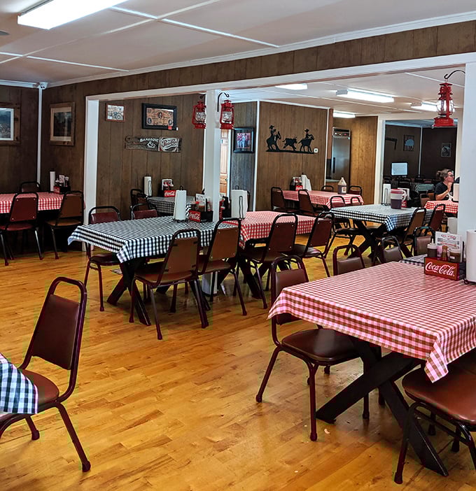 Red and black checkered tablecloths set the stage for barbecue bliss. This isn't designer dining—it's the real deal where napkins aren't decorative, they're necessary.