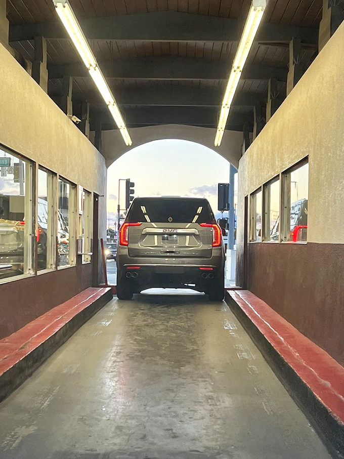 Driving through this sugary tunnel feels like entering Willy Wonka territory, except the golden ticket is replaced by golden-fried dough.