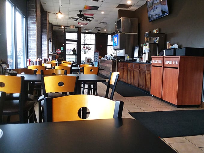 Inside, yellow chairs and wooden tables create the perfect no-nonsense setting for the serious business of barbecue consumption&mdash;function beautifully following form.