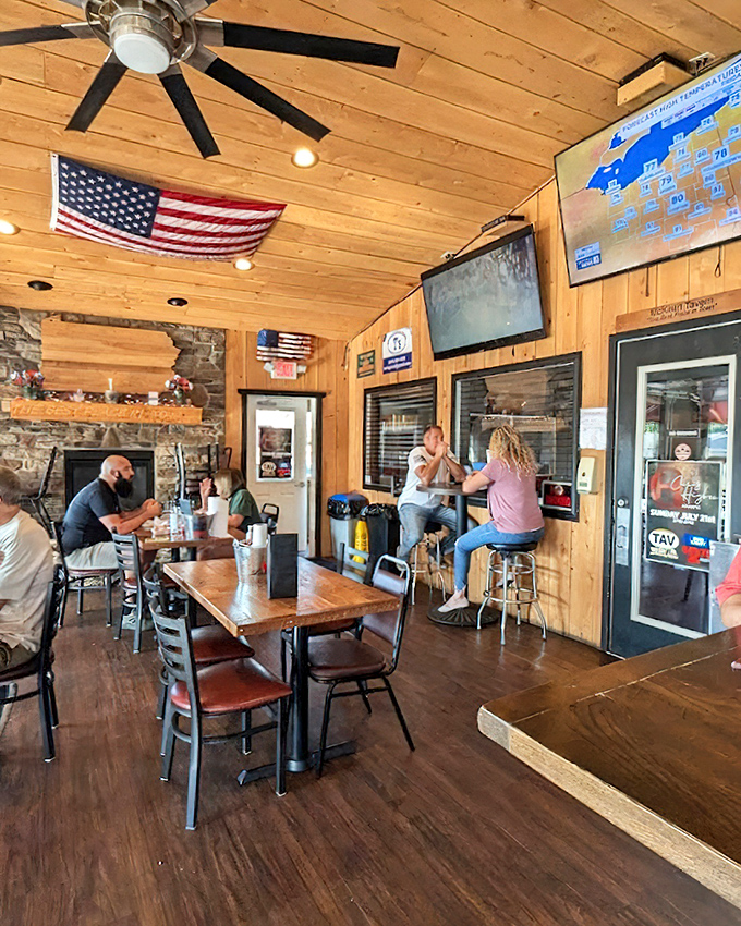 Where wood-paneled walls meet American pride. The tavern's interior feels like the living room of that friend who always throws the best Super Bowl parties.
