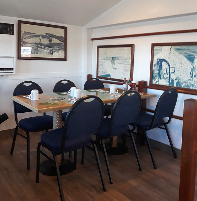 Black and white photos of fishermen adorn walls that have heard thousands of "you should have seen the one that got away" stories.