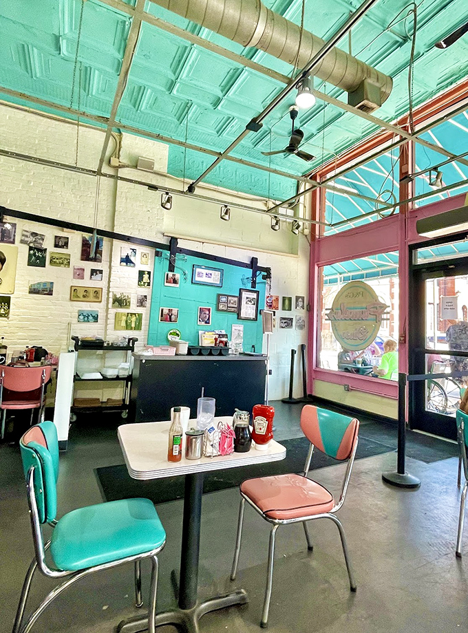 Retro diner vibes meet modern comfort in a space where turquoise dreams and coral wishes come deliciously true.