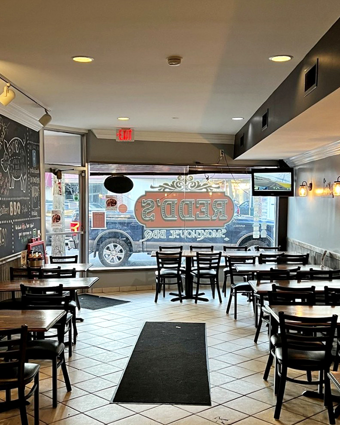 Simple tables, tile floors, and a chalkboard menu&mdash;Redd's interior says, "We're not here to impress you with chandeliers; we're here to change your life with brisket."