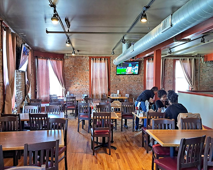 Exposed brick walls and wooden tables create that perfect "come as you are" vibe where morning conversations flow as freely as the coffee.