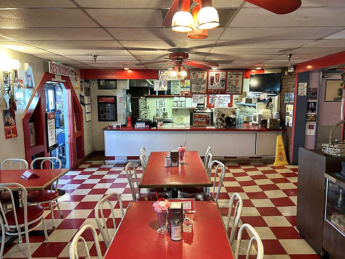 Classic red and white checkerboard floors set the stage for a genuine 50's experience. This isn't manufactured nostalgia&mdash;it's authentic Americana.