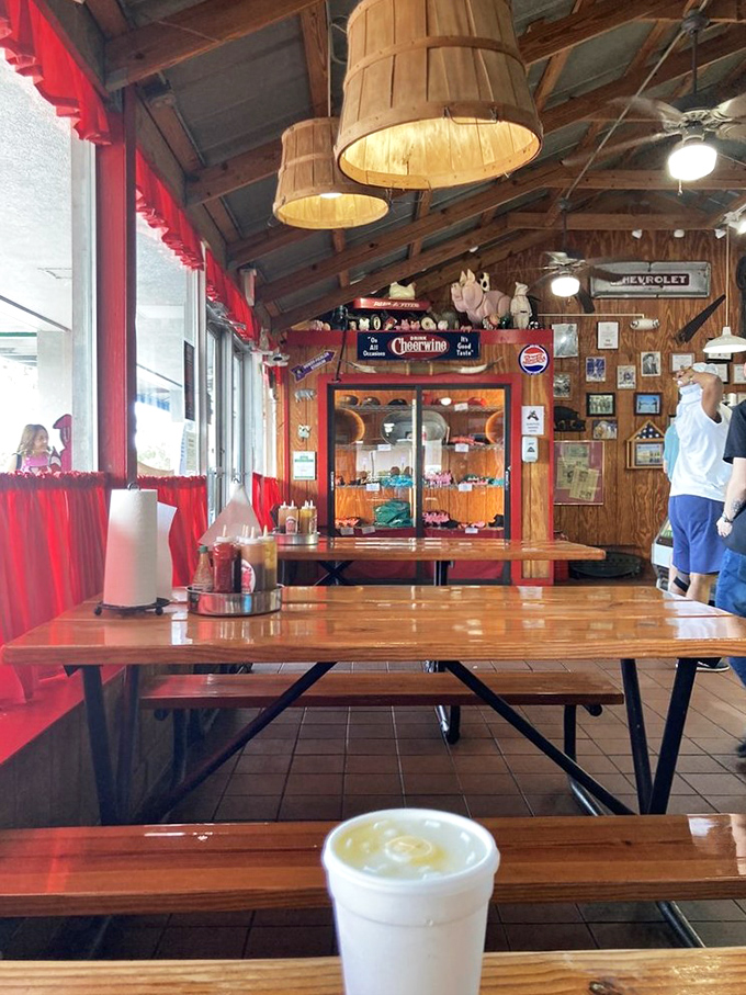 Wooden barrel lampshades and red checkered curtains set the stage for meat-centric memories. This isn't d&eacute;cor&mdash;it's BBQ theater in its most authentic form.