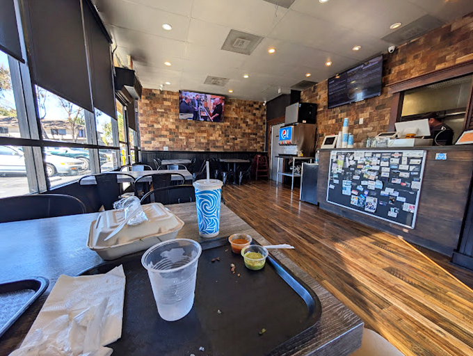 White tablecloths meet wooden beams in this dining room where nautical touches remind you that seafood reigns supreme here.