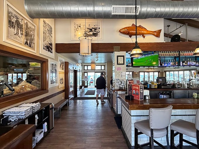 Inside, nautical charm meets casual elegance. That wooden fish overhead isn't just decoration&mdash;it's practically the maitre d' of this seafood sanctuary.
