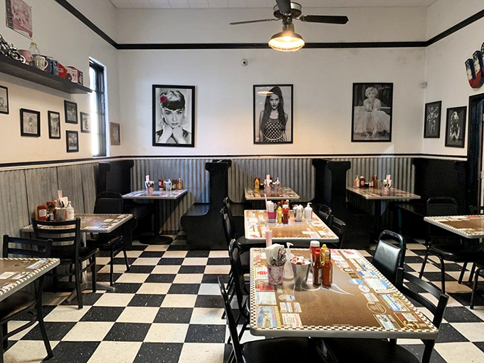 Classic black and white checkered floors, corrugated metal wainscoting, and vintage photos create the perfect backdrop for breakfast magic to unfold.