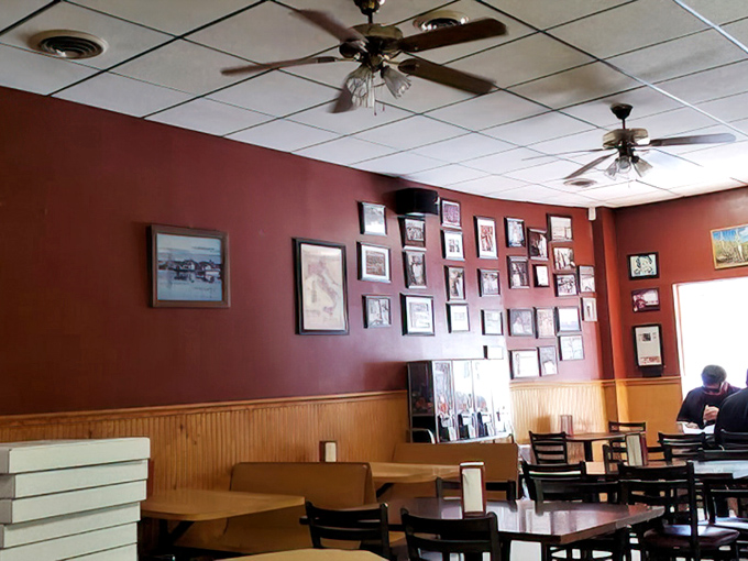 Red walls adorned with decades of memories tell stories that the menu can't, creating that perfect "been-here-forever" atmosphere that no designer could replicate.