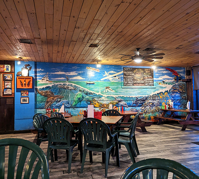 Wooden ceiling planks and vibrant ocean murals transport you to a coastal paradise without the airfare or sunburn.