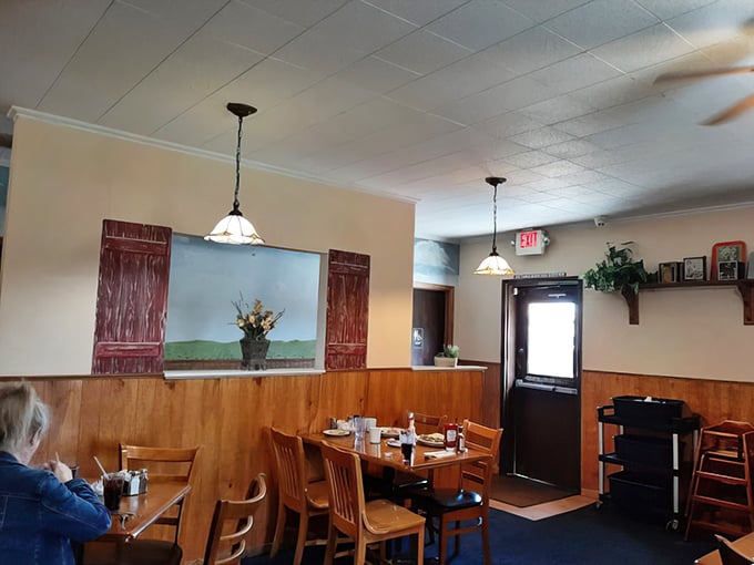 Wooden paneling and simple pendant lights create that rare atmosphere money can't buy&mdash;genuine small-town cafe warmth.