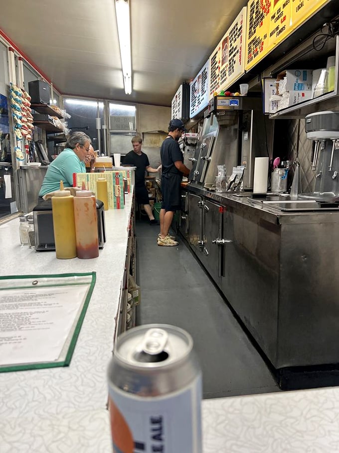 Inside this narrow temple of taste, sandwich artisans perform their craft with the precision of neurosurgeons and the passion of Italian grandmothers.