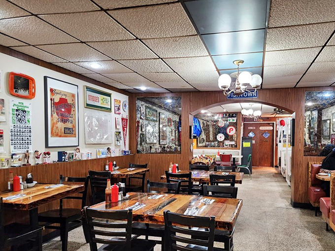 Classic wood paneling, memorabilia-covered walls, and no-nonsense tables create that perfect "been here forever" diner atmosphere that instantly feels like home.