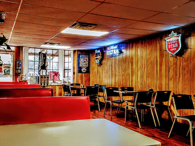 Classic wood paneling and neon beer signs – the universal language of "the food here is going to be worth every calorie."