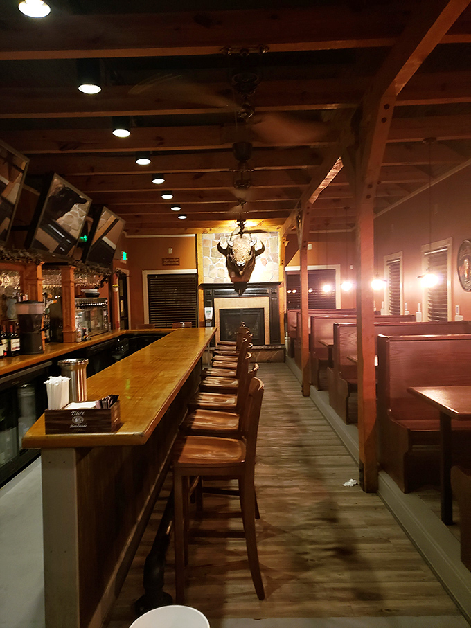 Wooden beams, warm lighting, and that magnificent buffalo head create the perfect backdrop for Maryland comfort food conversations.