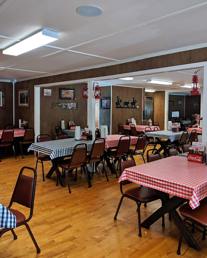 Classic red-and-white checkered tablecloths and wood-paneled walls create that "grandma's dining room meets smoke shack" vibe that signals authentic Southern barbecue awaits.