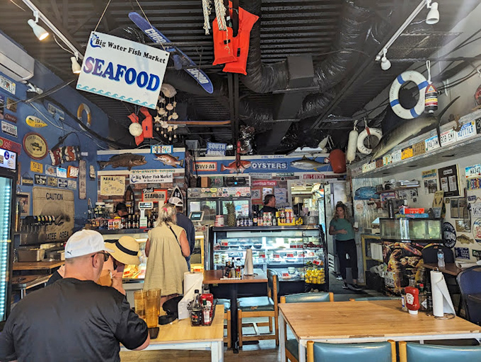 Nautical knickknacks and license plates create the perfect "I-caught-this-big" atmosphere. The black ceiling somehow makes this tiny space feel like an underwater cave of wonders.