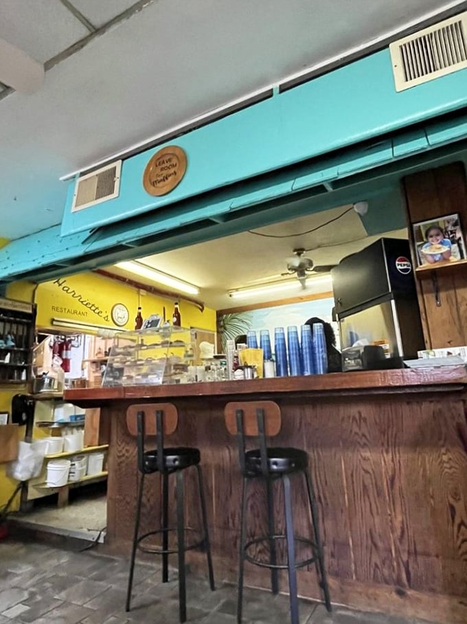 The open kitchen concept lets you witness the breakfast ballet unfold while enjoying classic diner charm.