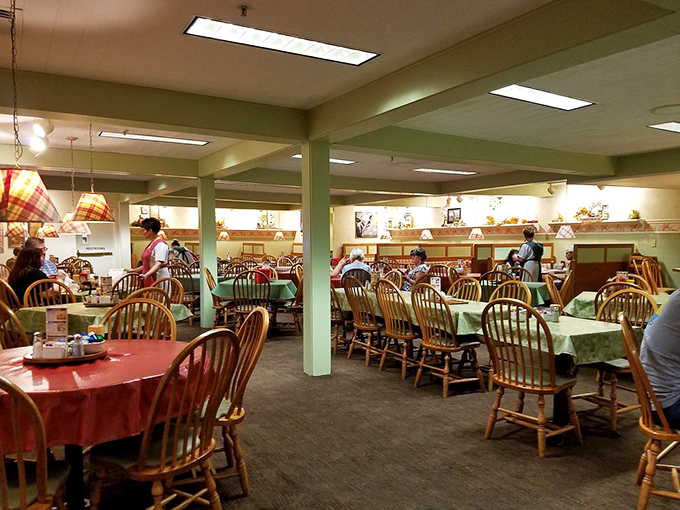 Windsor chairs and mint-green walls create the perfect backdrop for family gatherings, where conversations flow as freely as the gravy.