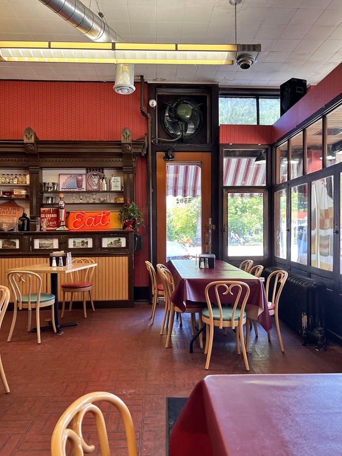 Step inside where red vinyl booths and checkered floors create pure soda fountain magic.