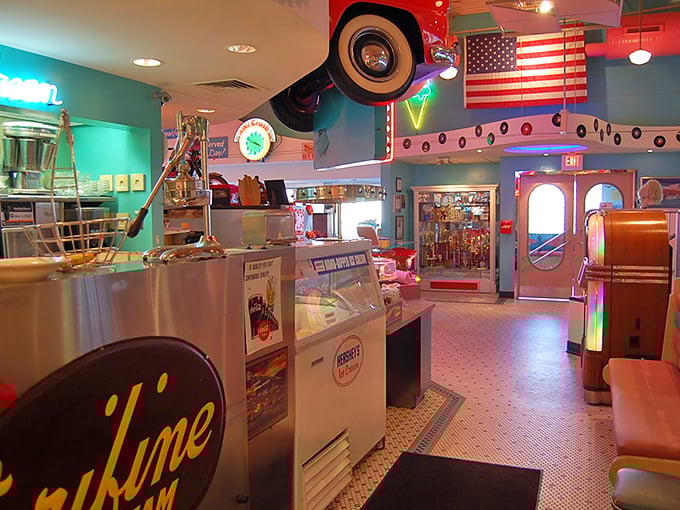 Step inside and you've entered a time machine with wheels. Classic cars, neon signs, and turquoise walls create the perfect backdrop for comfort food indulgence.
