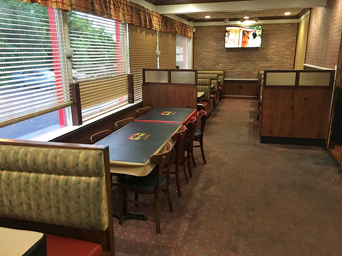 Classic booth seating where countless wing-induced epiphanies have transformed skeptics into true believers over decades.