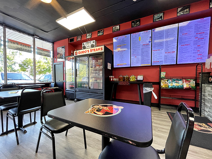 Red walls, simple tables, and a menu board that reads like a love letter to Philadelphia's sandwich heritage.