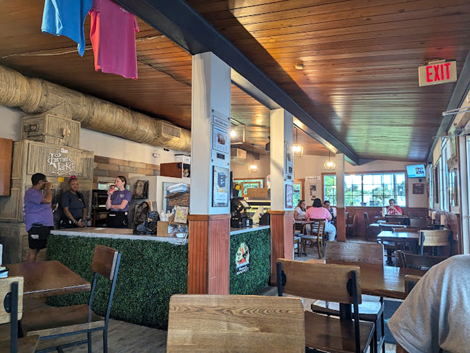 Inside, wooden ceiling beams and cozy seating create that rare atmosphere where strangers become neighbors and calories don't count.
