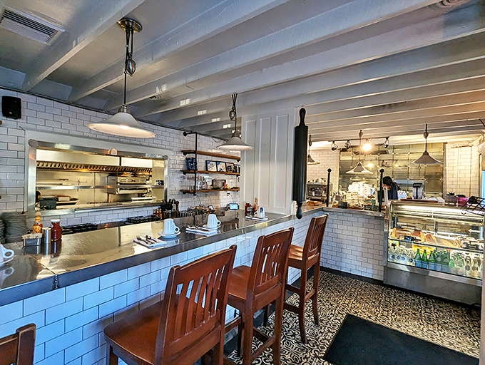 Counter seating that puts you front-row for the breakfast ballet&mdash;where subway tiles and wooden chairs create the perfect backdrop for morning magic.