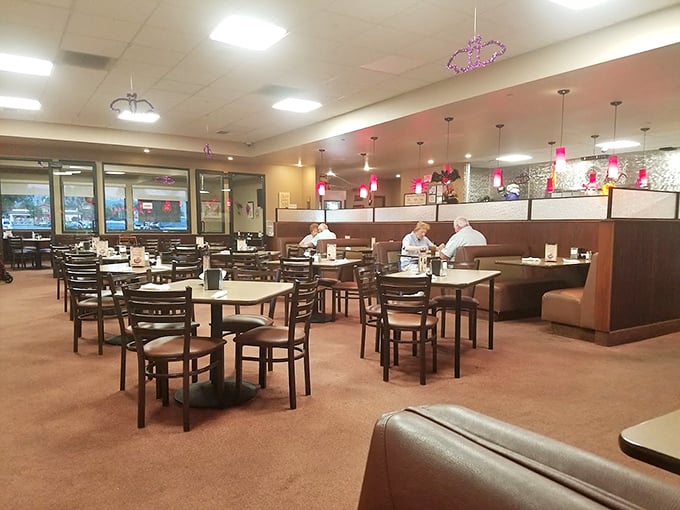 Where booths become thrones and every table feels like the best seat in the house. The warm lighting says "stay awhile" even before the menu arrives.