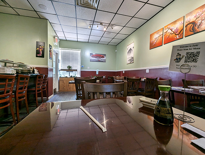 The cozy interior balances simplicity with charm &ndash; those cherry blossom paintings aren't just decoration, they're a promise of the artistry to come.