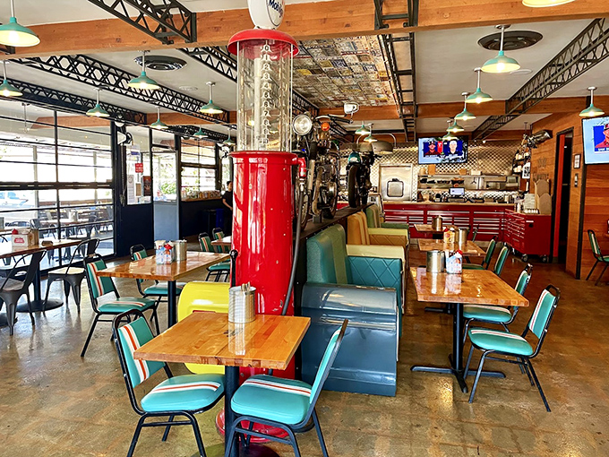 Industrial-chic meets comfort in this dining room where the gleaming red smoker stands like a shrine to slow-cooked perfection.