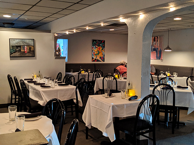 White tablecloths meet casual comfort in Fenicci's dining room, where family celebrations and first dates coexist in pasta-scented harmony.