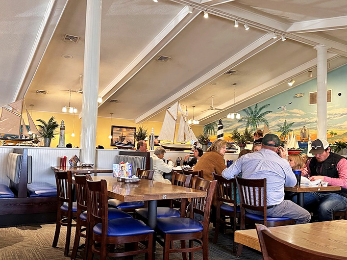 Step inside and you're transported to a coastal getaway, where model ships and ocean murals set the stage for seafood magic.