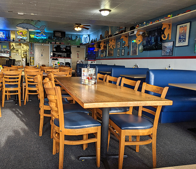 Inside, wooden tables and blue booth seating create that perfect "I've discovered something special" vibe that makes coastal dining so memorable.