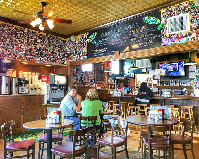 Where burger magic happens. The cozy interior with its memorabilia-covered walls tells stories of countless satisfied customers through the years.