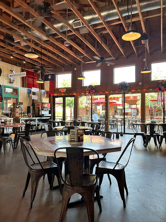Inside, exposed wooden beams and Texas pride create the perfect backdrop for the serious business of burger consumption.