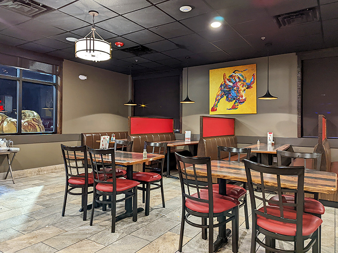 Clean lines, warm colors, and that vibrant bull artwork watching over diners. The kind of unpretentious space where food, not decor, does the talking.