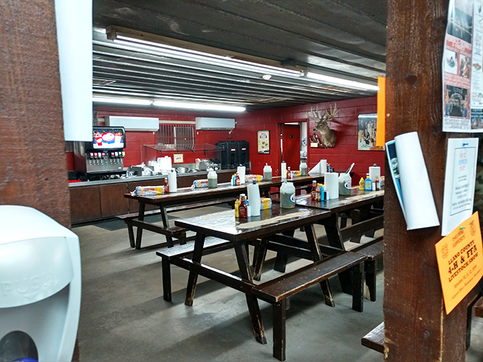 Communal dining at its finest&mdash;wooden picnic tables adorned with all the fixings, where strangers become friends over smoked meat magic.