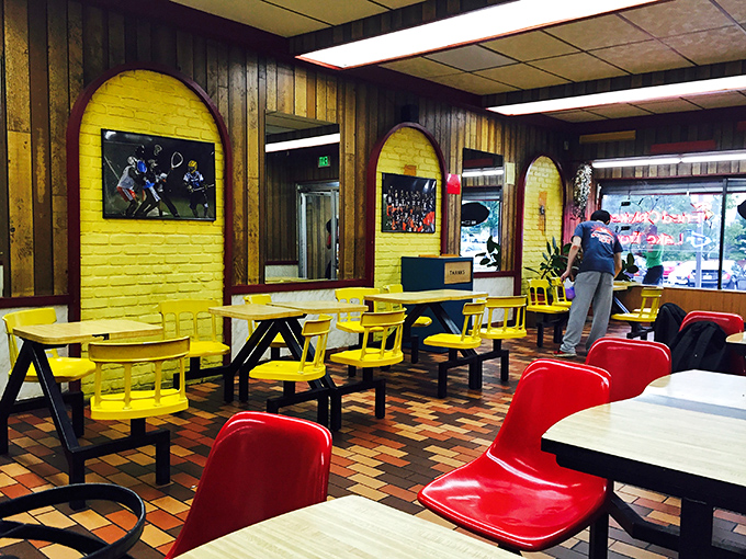 Yellow walls and red chairs create a cheerful diner atmosphere that says, "Stay awhile!" This isn't Instagram-bait decor&mdash;it's genuine Baltimore comfort.