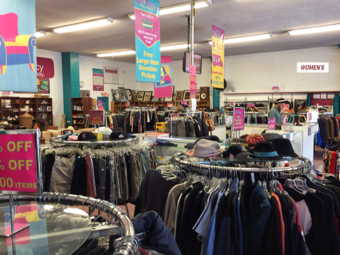 Circular racks create a thrifter's labyrinth where $30 can transform into an entire wardrobe. The hunt begins here!