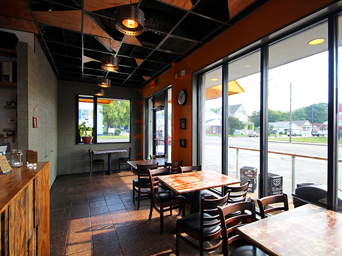 Simple wooden tables bathed in natural light create an unpretentious atmosphere where the food, not the decor, takes center stage.