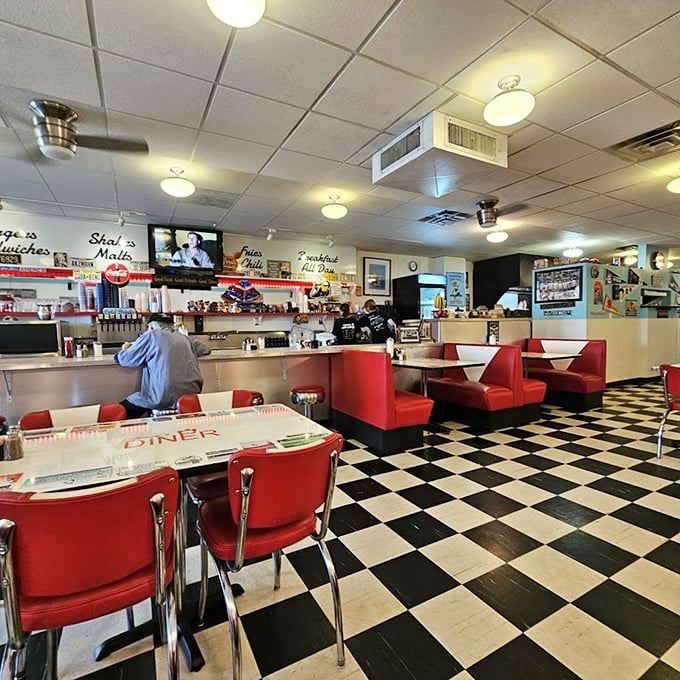 Step inside and time travel to the golden age of diners &ndash; red vinyl booths, checkerboard floors, and counter seating that practically begs you to order a second cup of coffee.