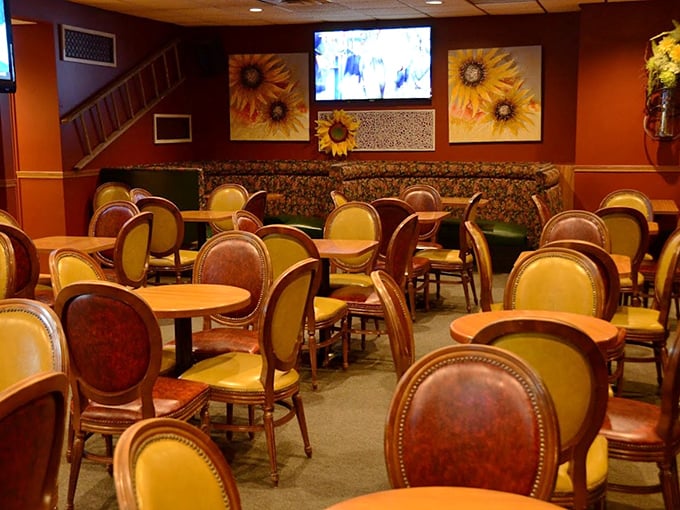 Inside, sunflower artwork brightens warm wood tones, creating that perfect balance of special-occasion worthy yet completely relaxed dining atmosphere.