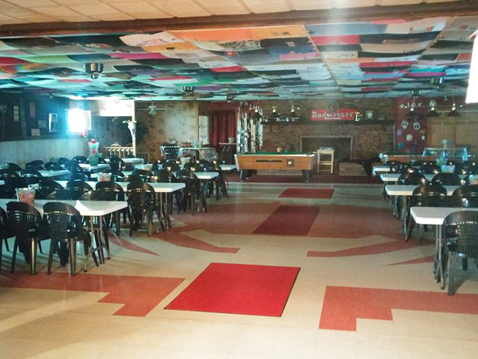 Inside, fabric-adorned ceilings and geometric floors set the unpretentious stage where seafood, not decor, rightfully steals the spotlight.