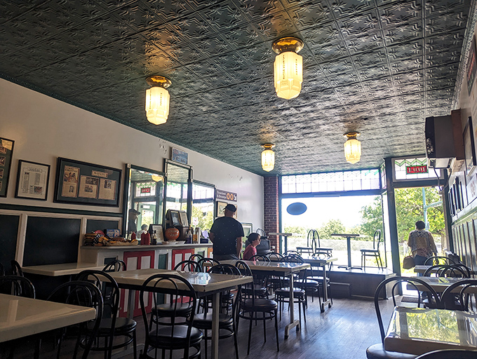 Tin ceilings, simple lighting, and no-nonsense tables create the perfect stage where the real stars&mdash;those magnificent burgers&mdash;can shine without distraction.