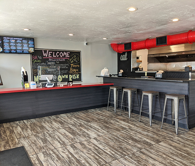 Industrial chic meets sandwich sanctuary. Those red pipes aren't just functional &ndash; they're foreshadowing the flavor explosion about to happen in your mouth.